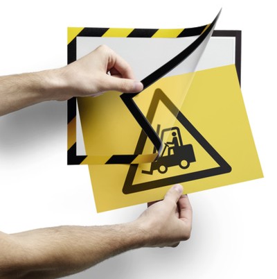 Adhesive safety sign holder